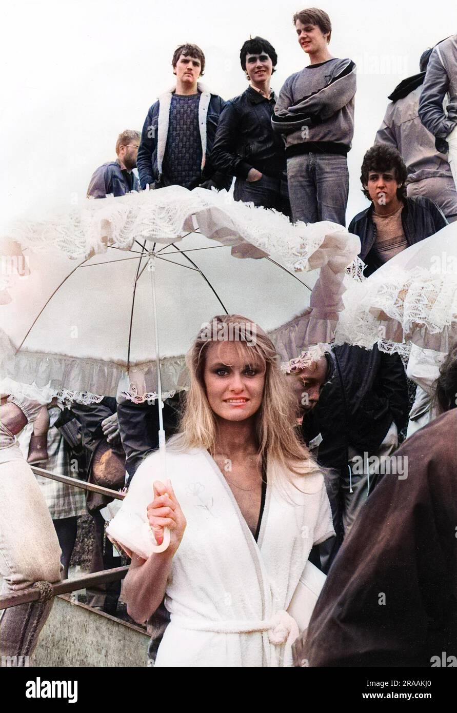 People in the rain, watching filming during the Miss UK competition, St ...