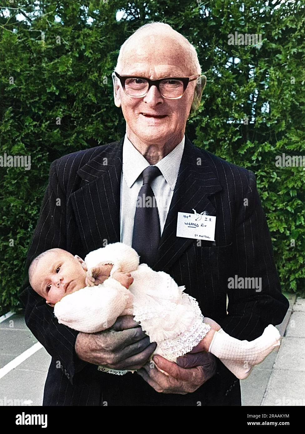 A great-grandfather holding his great-grandson Stock Photo - Alamy