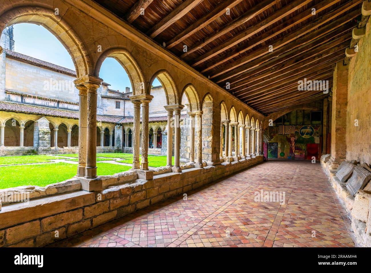 Cloister with double arched columns in medieval Collegiate Church of ...