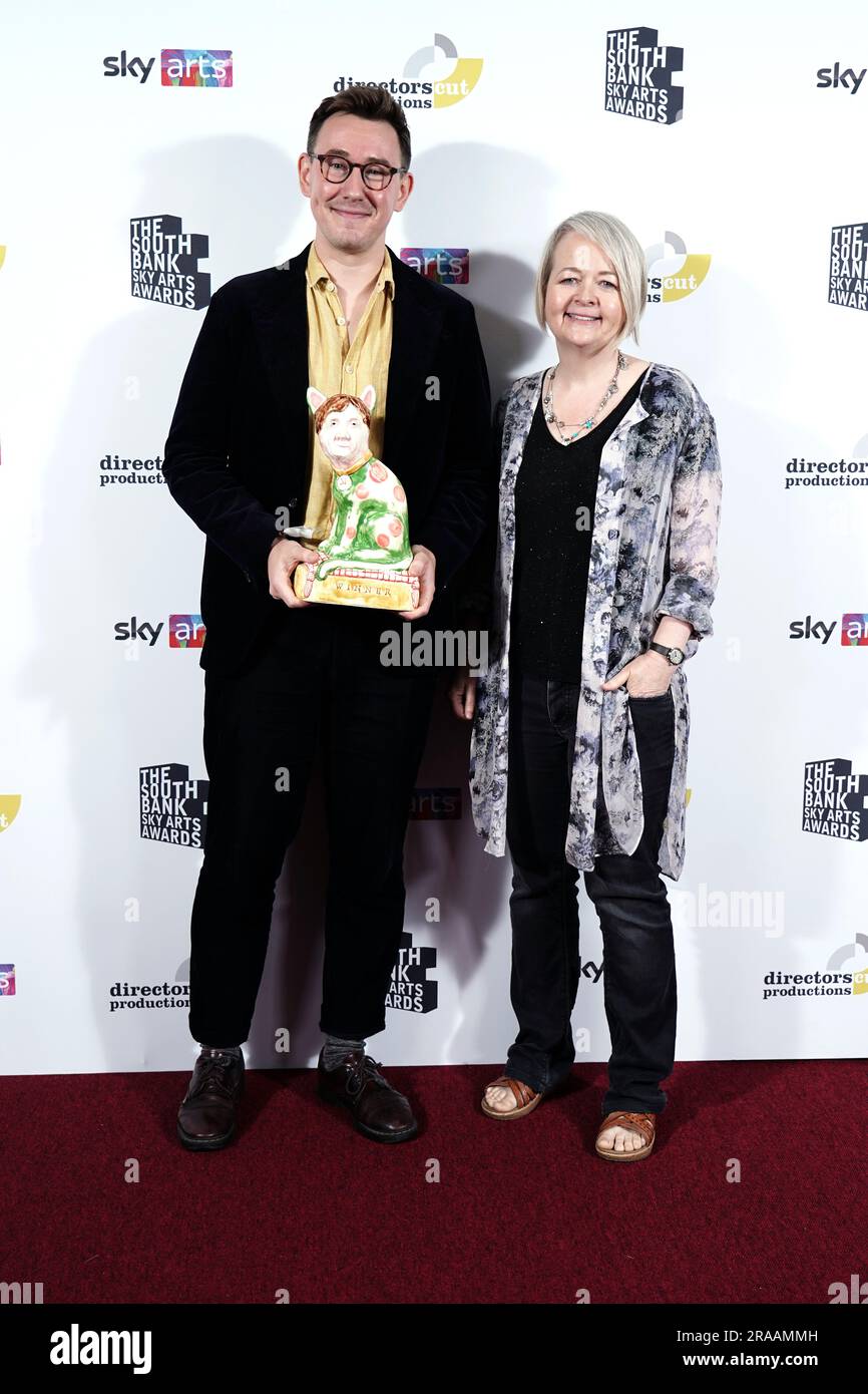 Sarah Waters (right) presents Tom Crewe with the literature award at ...
