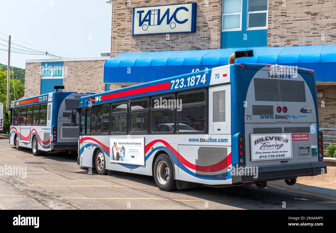 Two public busses parked in front of the Warren County Transit ...