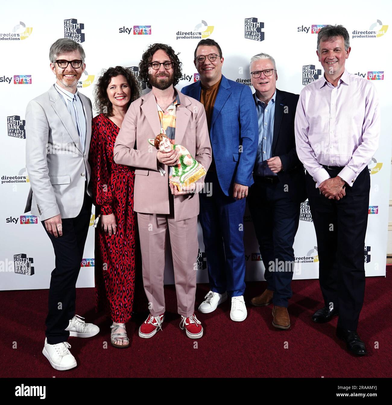 Gareth Malone (left) presents Gavin Higgins (third left) with the ...
