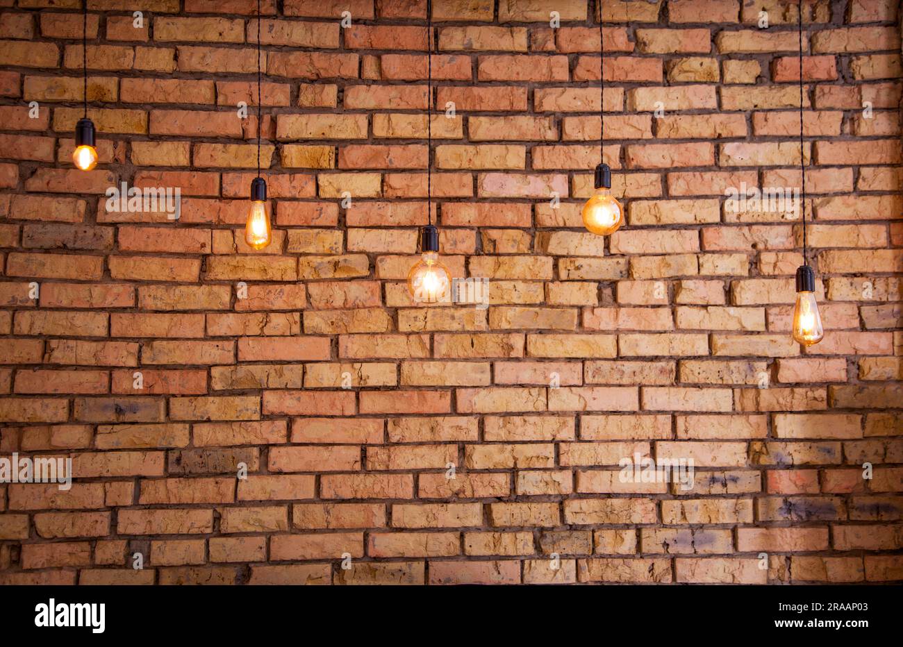 Old electric incandescent lamps with tungsten filament. Against the ...