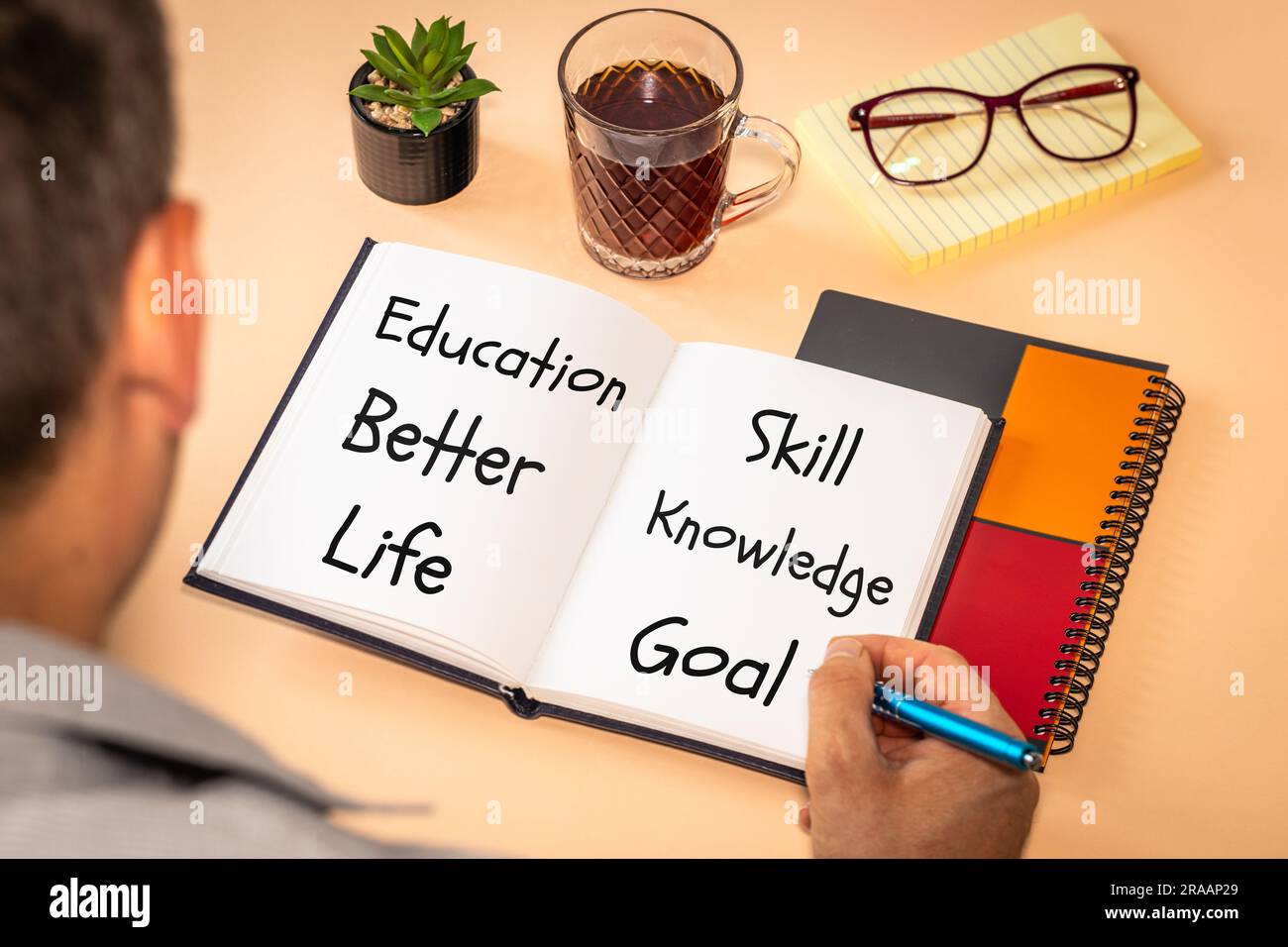 Words written in a notebook, Education better life, skill knowledge ...