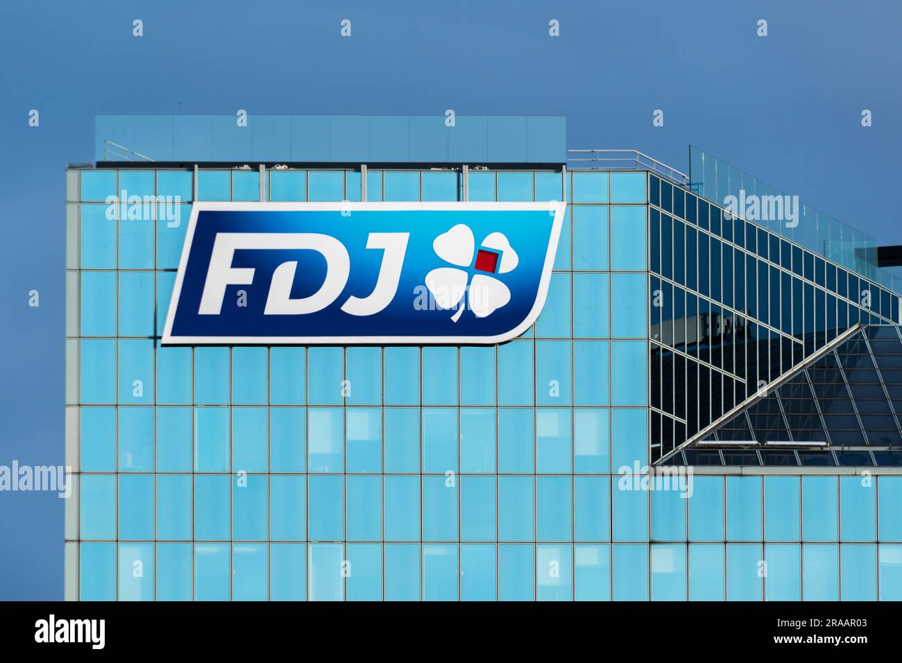 Sign and logo on the facade of the building housing the headquarters of ...