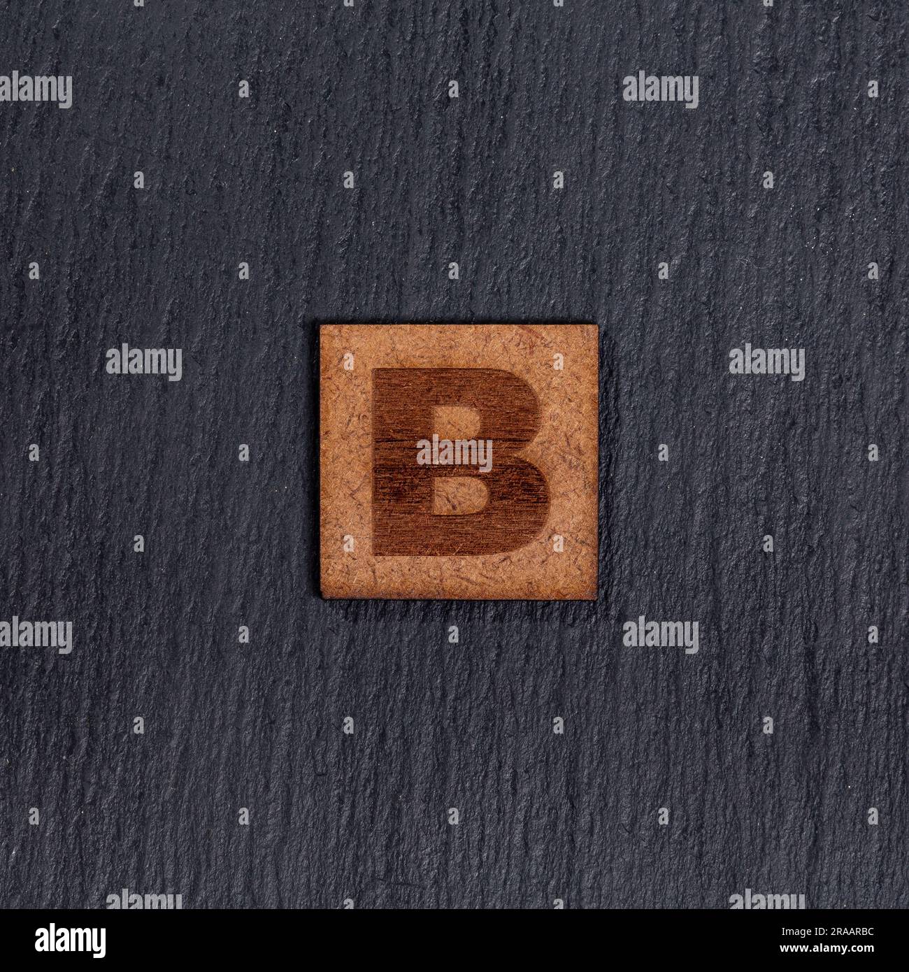 Capital Letter In Square Wooden Tiles - Letter B, On Black Stone ...
