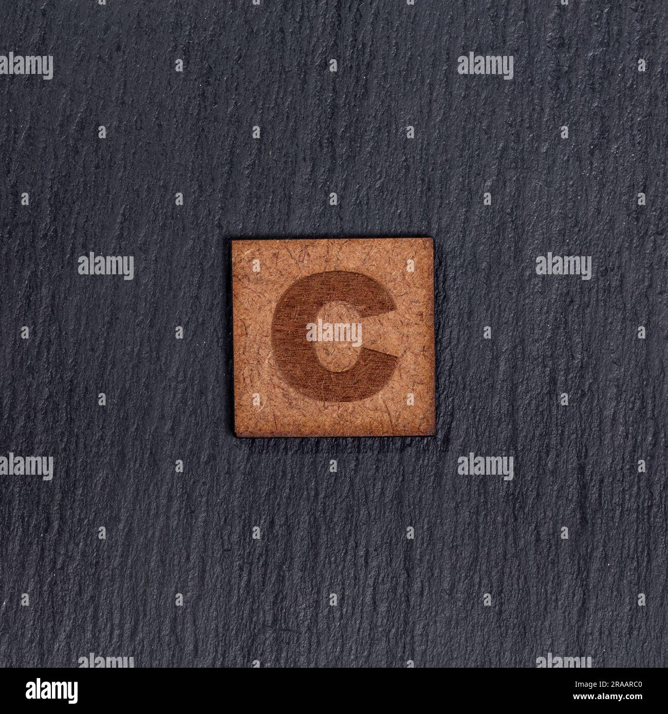 Capital Letter In Square Wooden Tiles - Letter C, On Black Stone ...