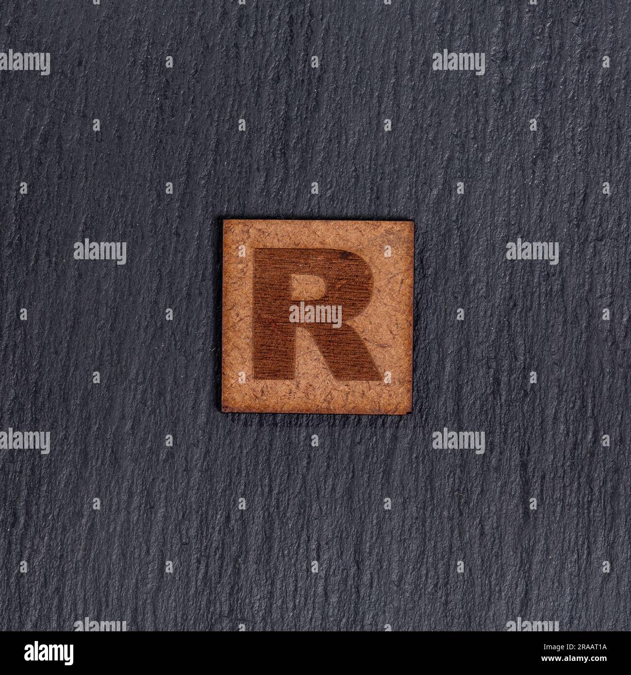 Capital Letter In Square Wooden Tiles - Letter R, On Black Stone ...