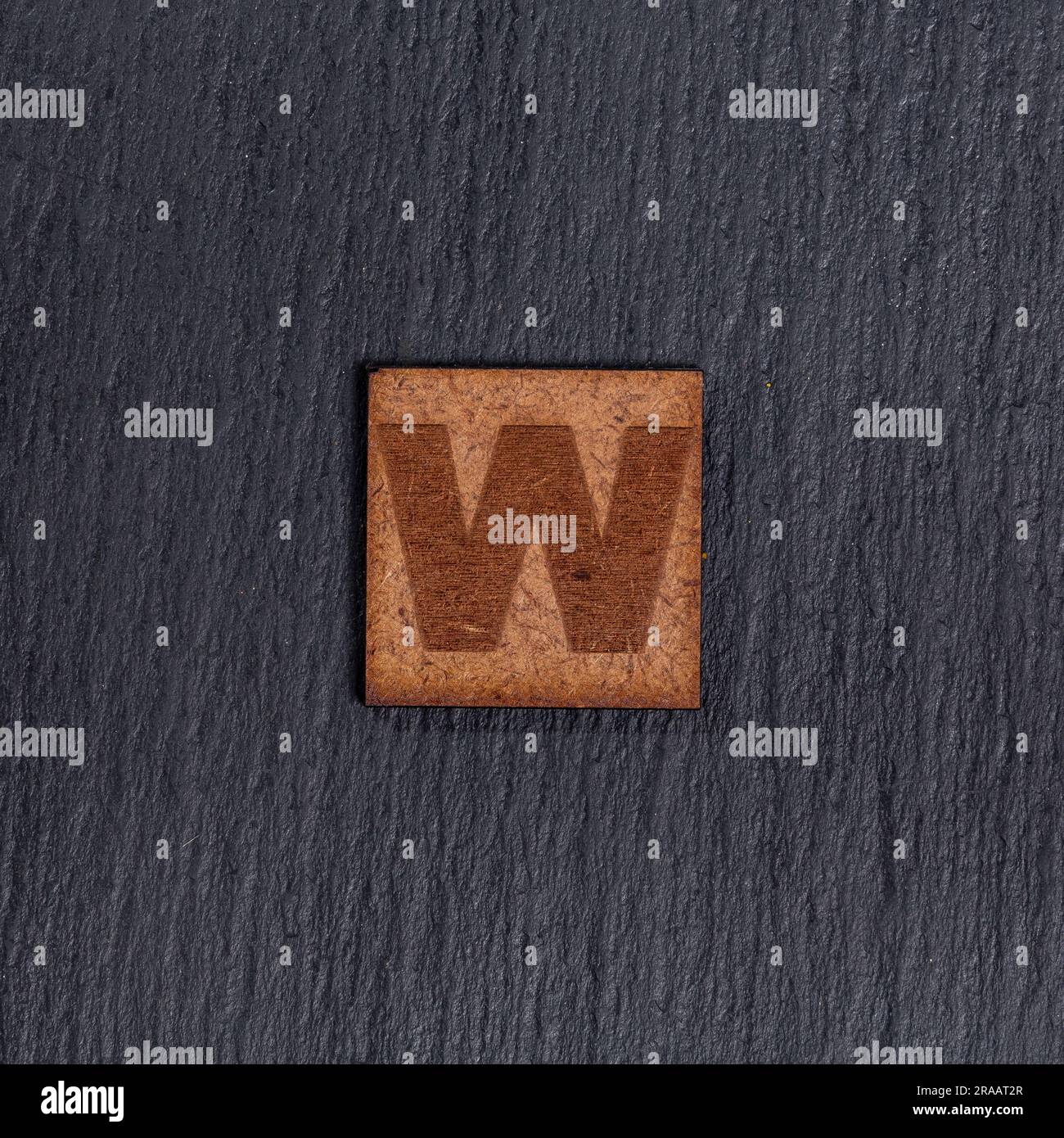 Capital Letter In Square Wooden Tiles - Letter W, On Black Stone ...