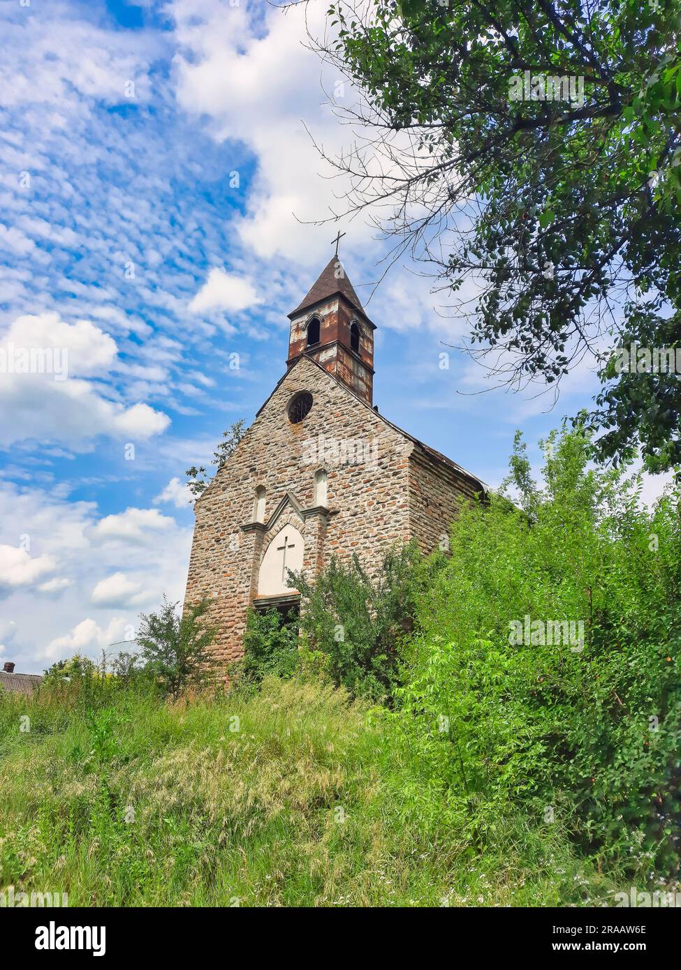 Old small church. The ruins of an old church among the grasses on the ...