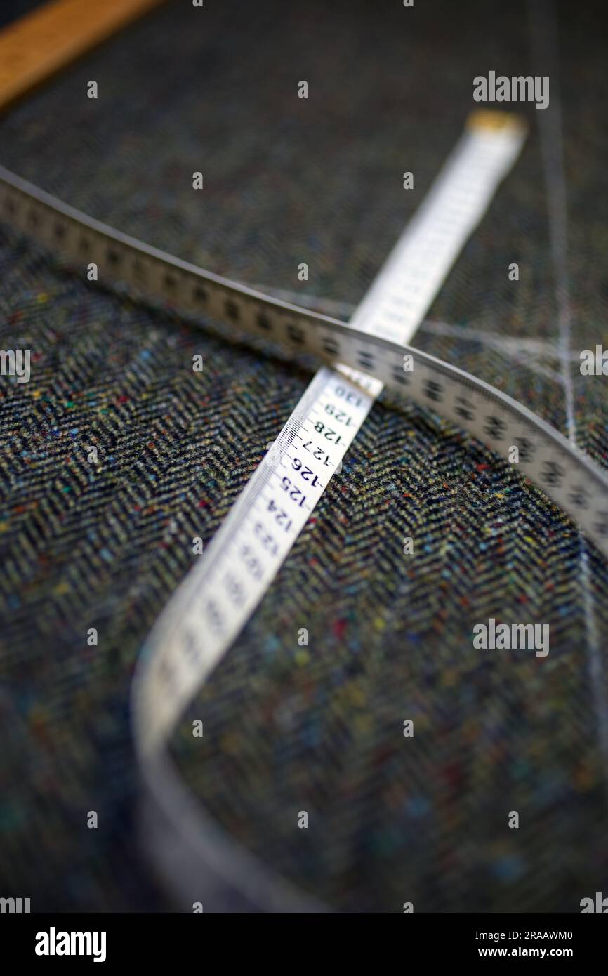 Measuring Tape and garment marked with chalk at the tailor Stock Photo ...