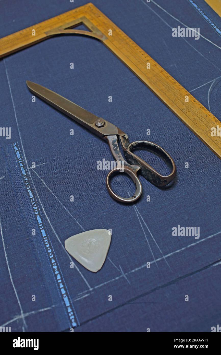 Old tailor measuring tool vintage angel ruler and scissors Stock Photo ...