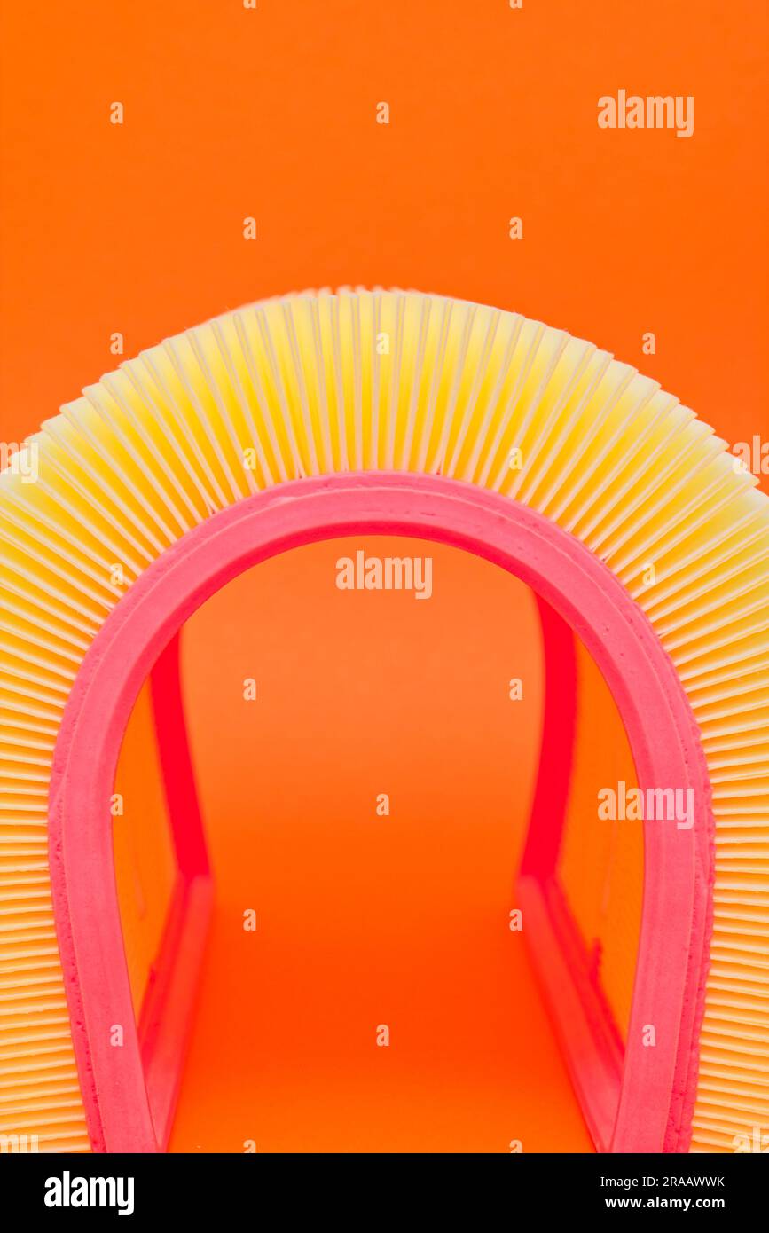 An abstract image of the air new filter. Orange background Stock Photo ...