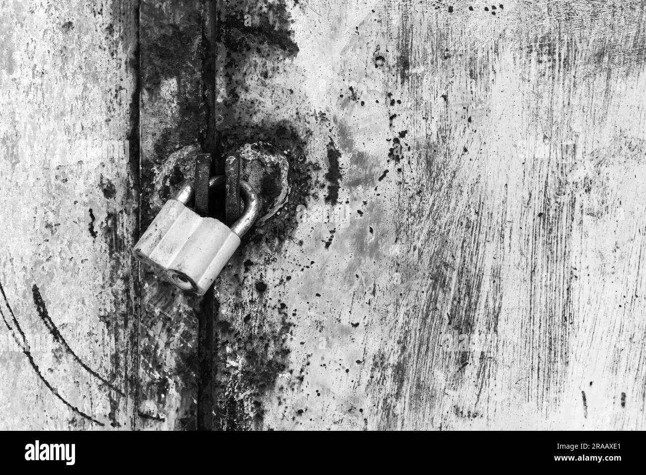 Old rusty lock on metal doors. Lock on the door with an empty place for ...