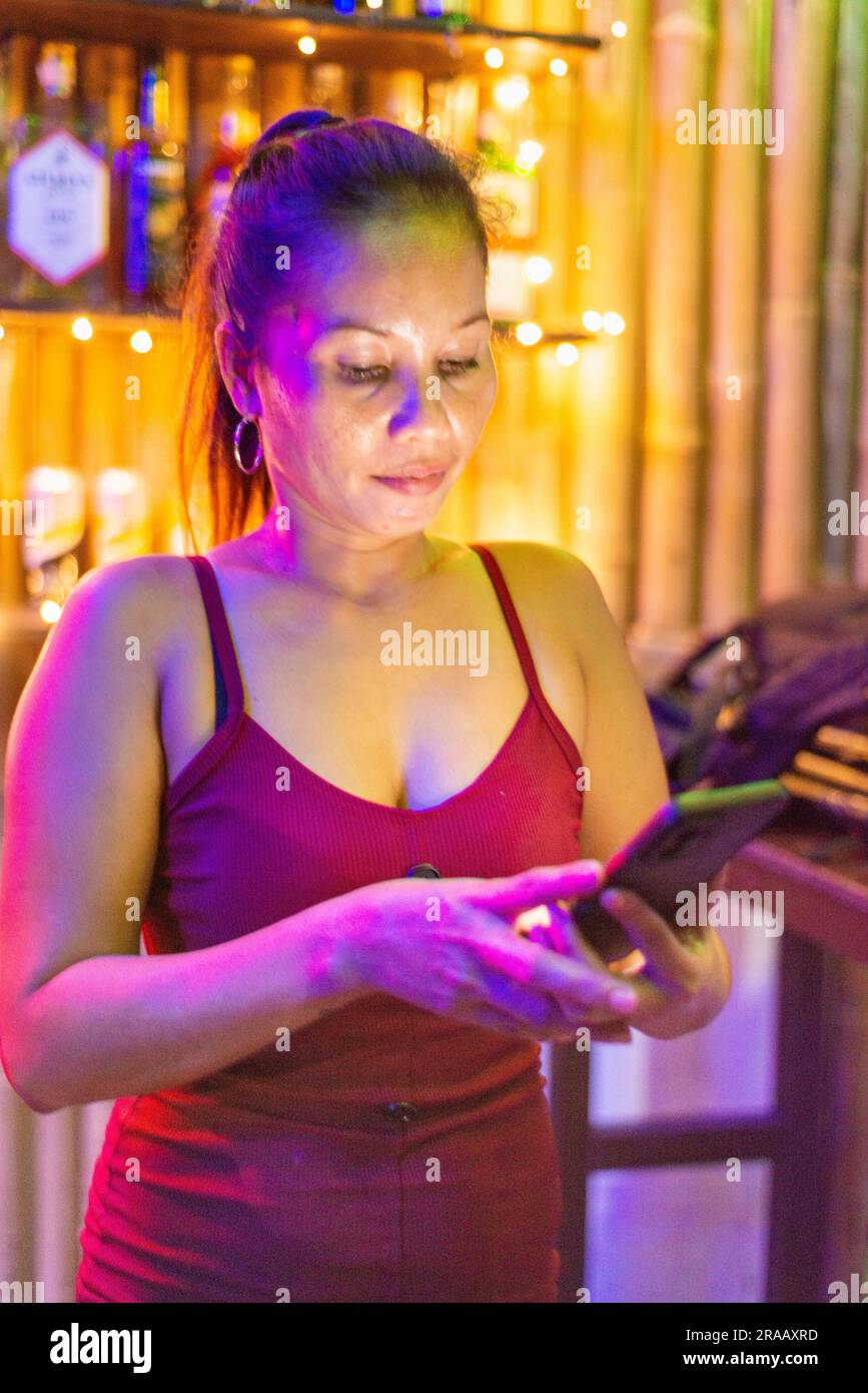 Cebu,The Philippines-January 20th 2023:At a small,makeshift late night bar,in the popular diving ...