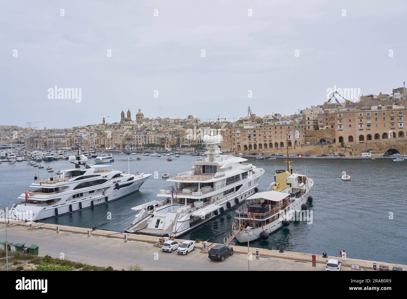 Luxury boats moored alongside Fort Saint Angelo in Grand Harbour ...