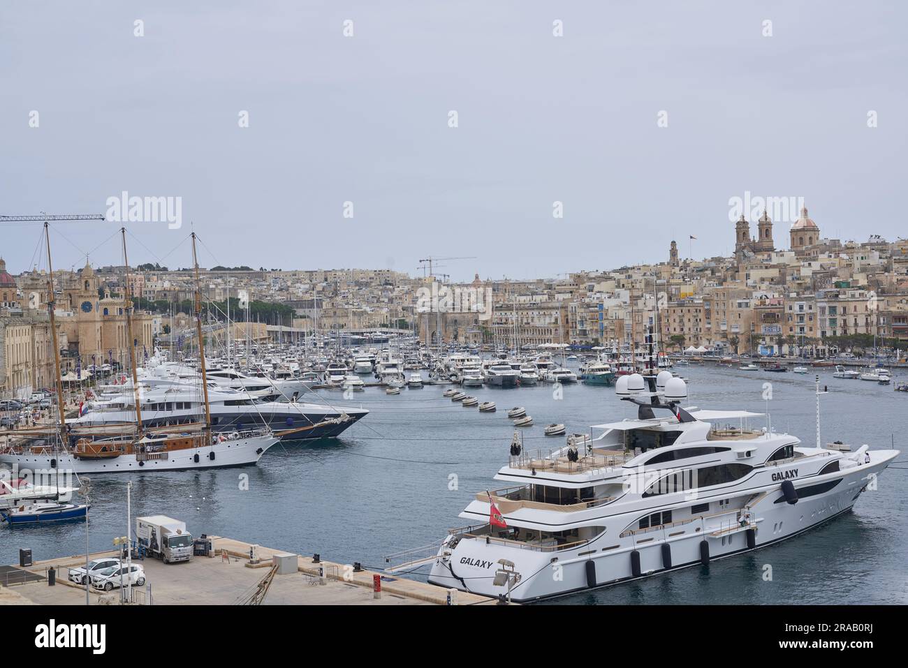Luxury boats moored alongside Fort Saint Angelo in Grand Harbour ...