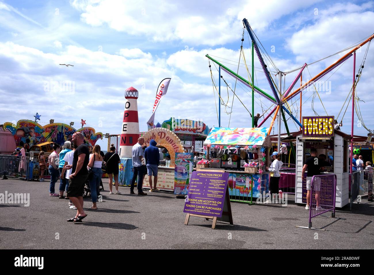 tourists and children at a funfair on herne bay pier, isle of thanet ...