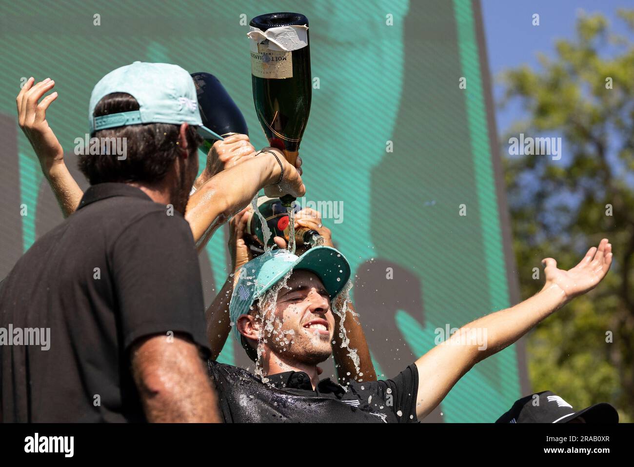 First-place team champions Torque GC celebrate as they pour champagne ...