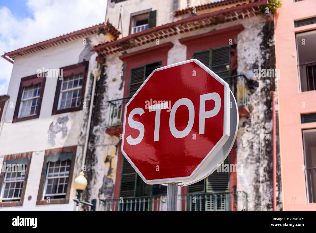 Stop sign in front of some old European buildings Stock Photo - Alamy