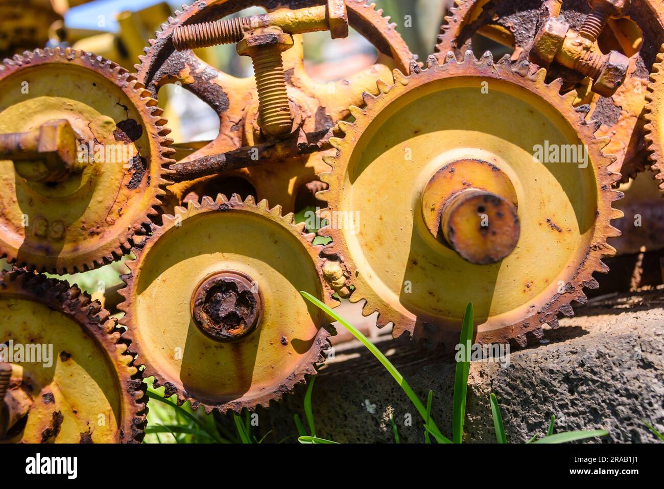 Yellow rusty gears from an old marine winch lying on the ground Stock ...
