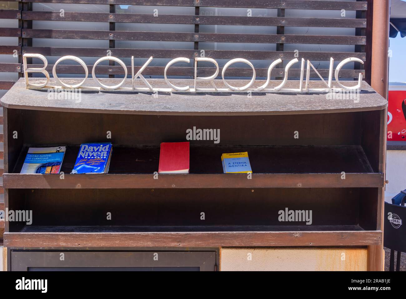 "Book crossing" sign on a bookshelf, encouraging people to swap books ...