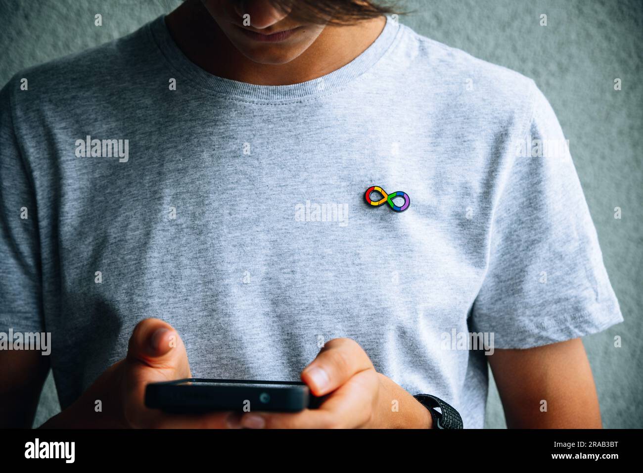 Teenage boy with autism infinity rainbow symbol sign metallic pin ...