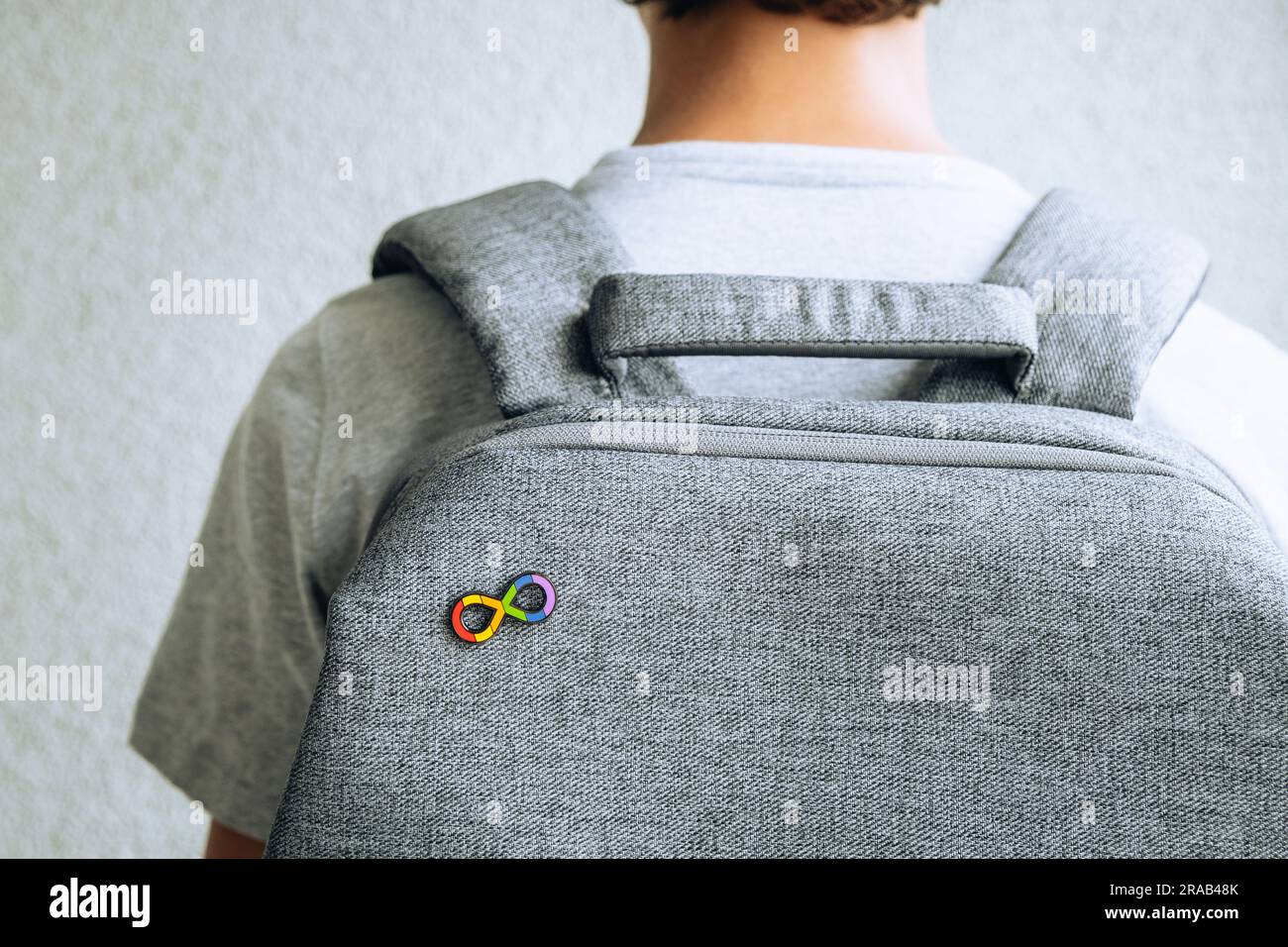 Teenage boy with autism infinity rainbow symbol sign metallic pin ...