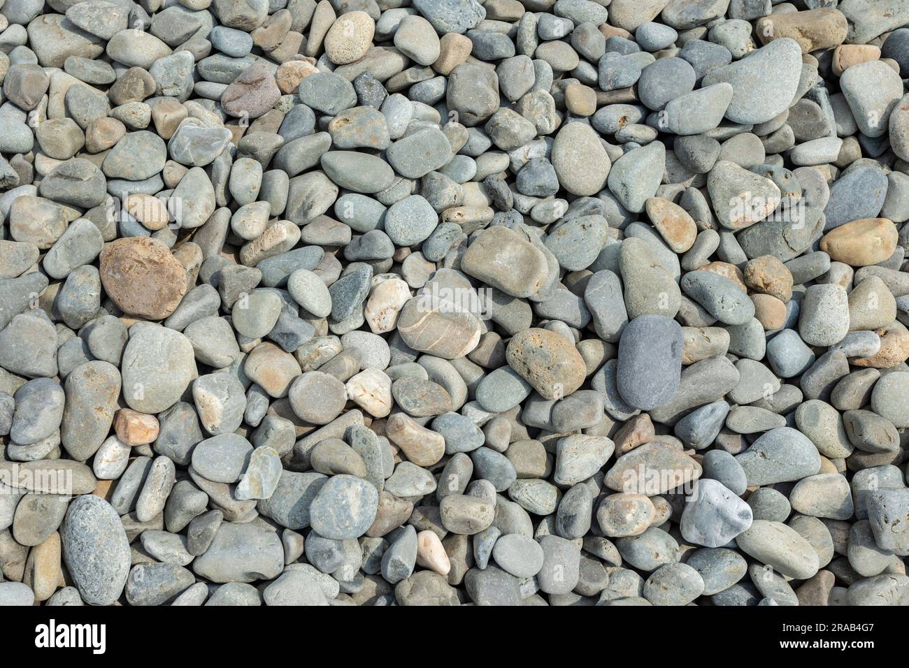 Abstract smooth round pebbles sea texture background Stock Photo - Alamy