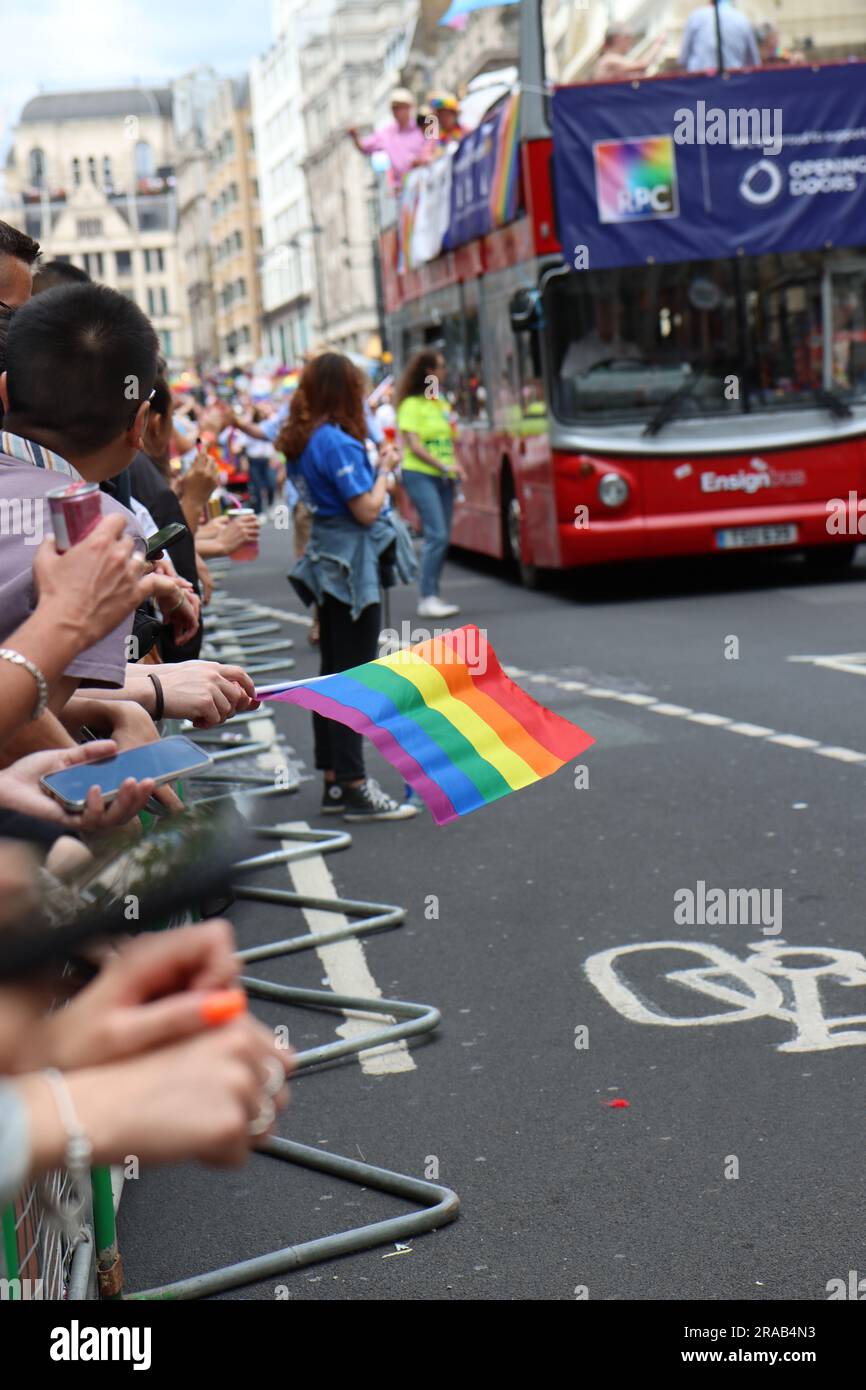 Handheld pride flag held over railing at London Pride 2023 Stock Photo ...