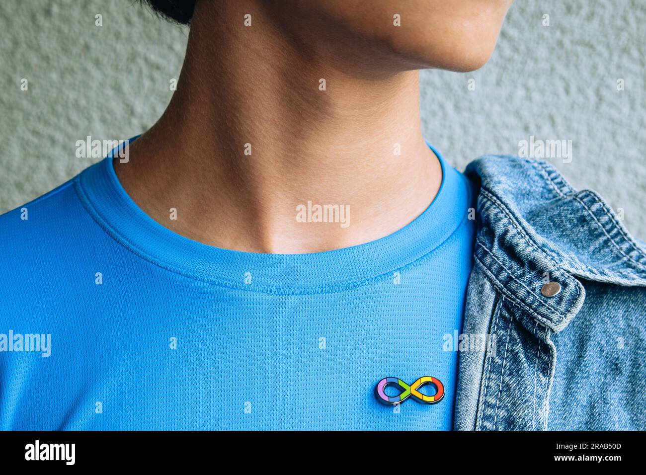 Teenage boy with autism infinity rainbow symbol sign metallic pin ...