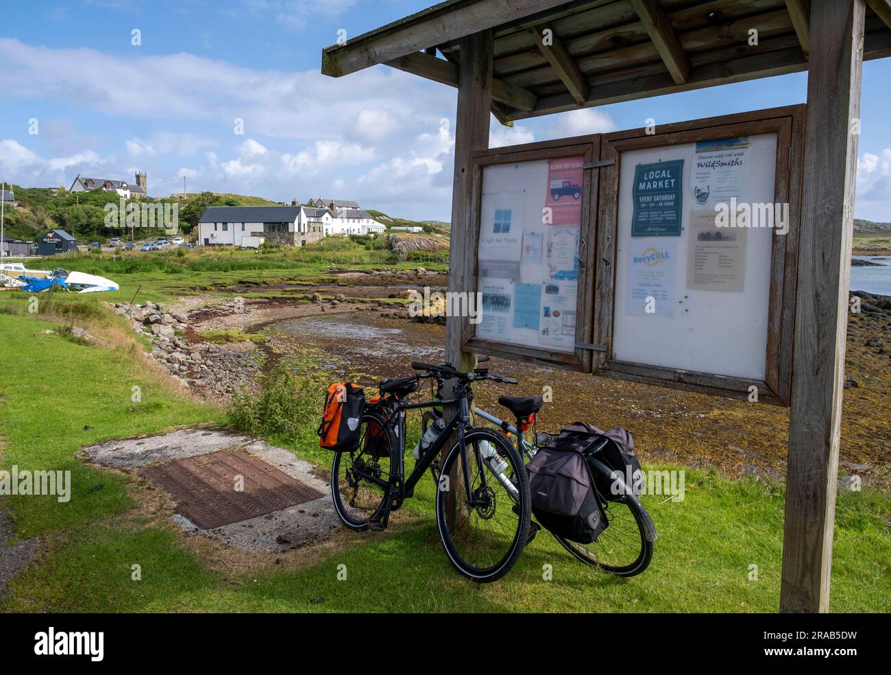 Bicycles leaning against a notice board in the village of Arinagour ...