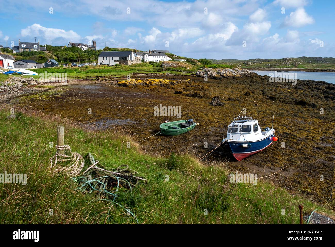 Boats at low tide in front of the Isle of Coll Hotel, Arinagour, Isle ...