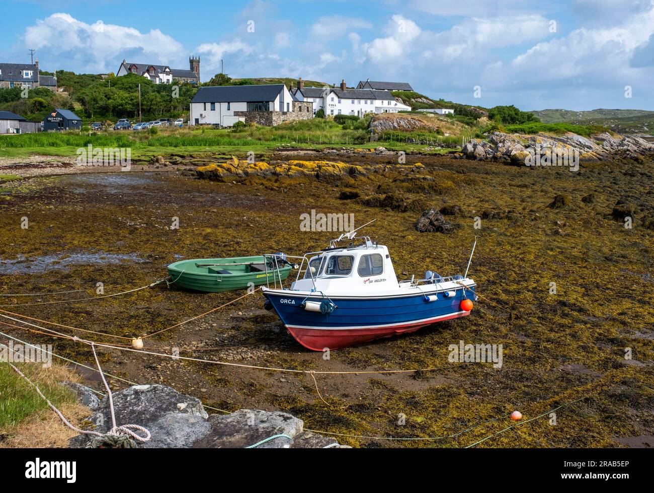 Boats at low tide in front of the Isle of Coll Hotel, Arinagour, Isle ...