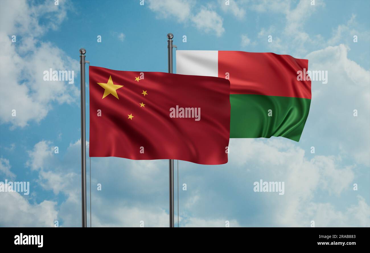 Madagascar flag and China flag waving together on blue sky, two country ...