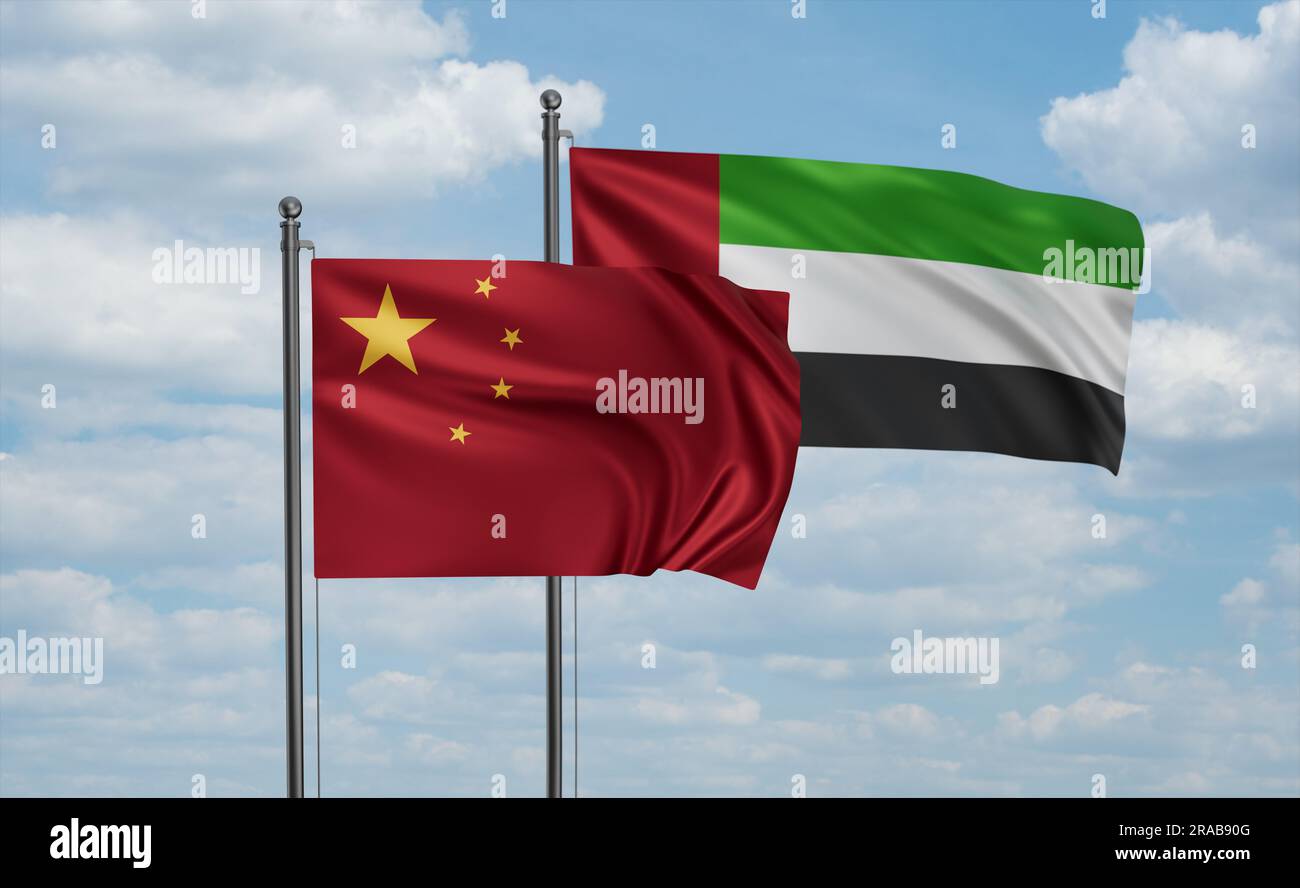 United Arab Emirates and China flag waving together in the wind on blue ...