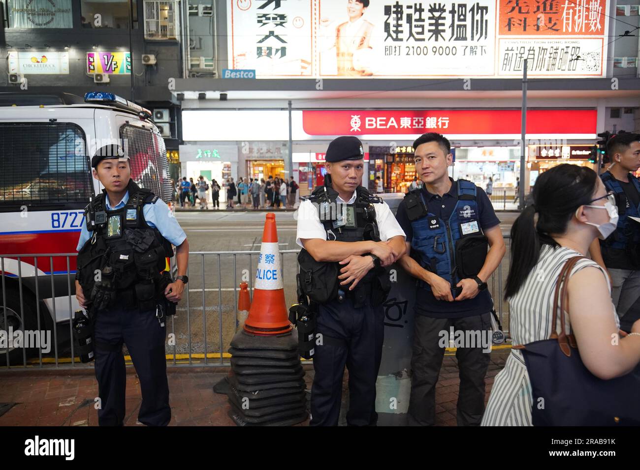 Hong Kong, China. 01st July, 2023. Police officers stand on the street ...