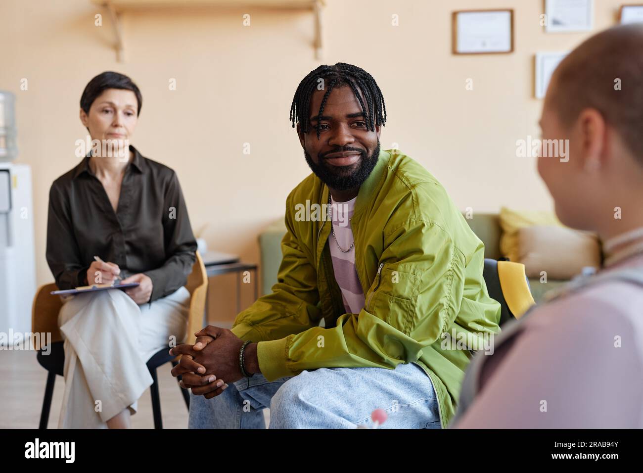 Group of people talking to each other while sitting at psycho session ...