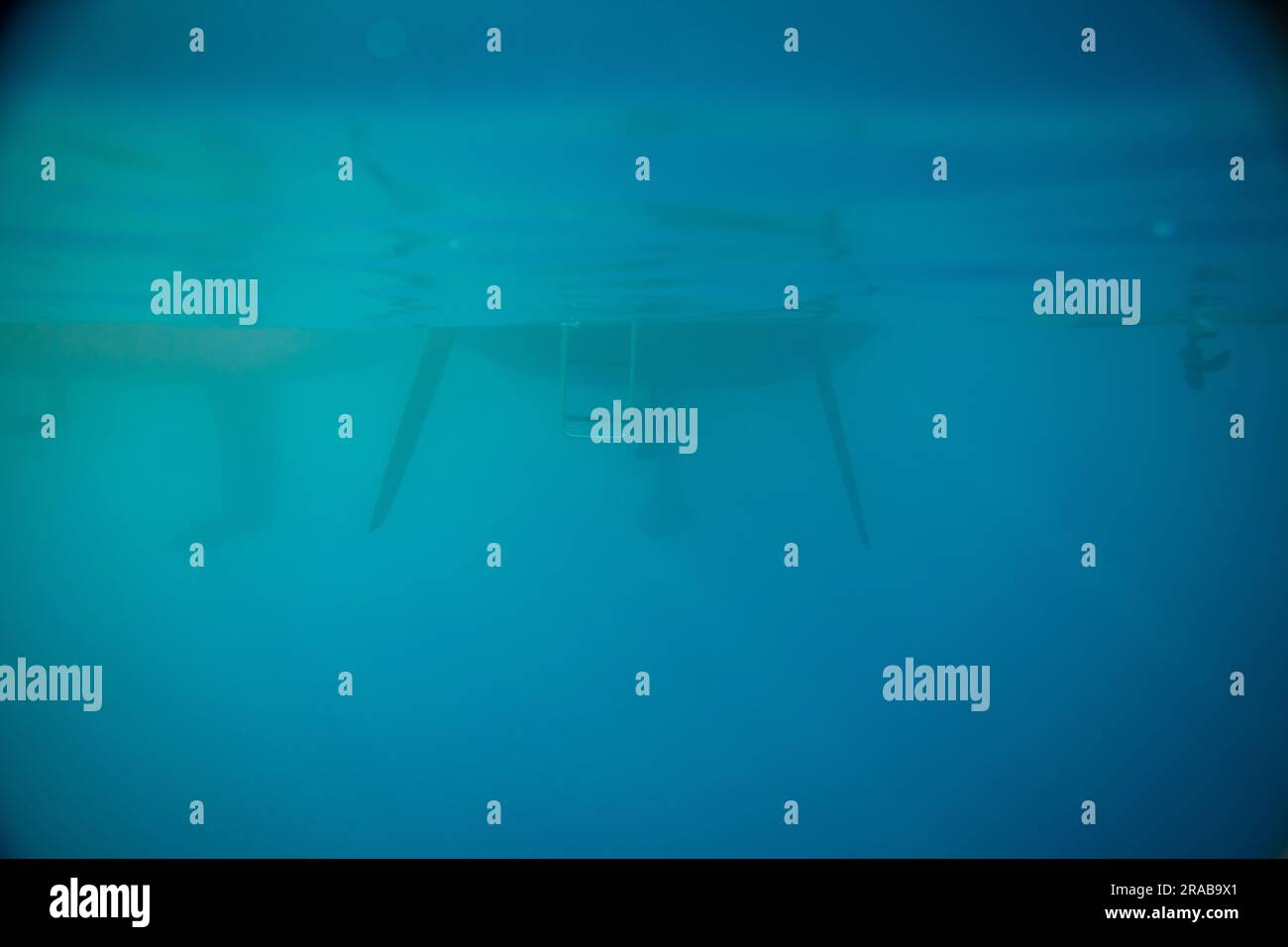 Underwater view of the propellers of a yacht in the blue water of Sea ...