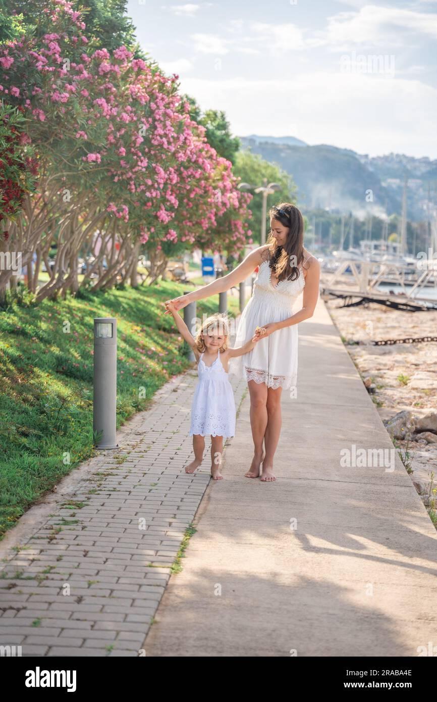 Happy mother and daughter child having fun on luxury yachts on ...
