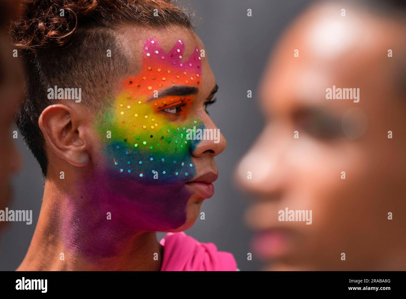 A reveler takes part in the Gay Pride march in Caracas, Venezuela ...