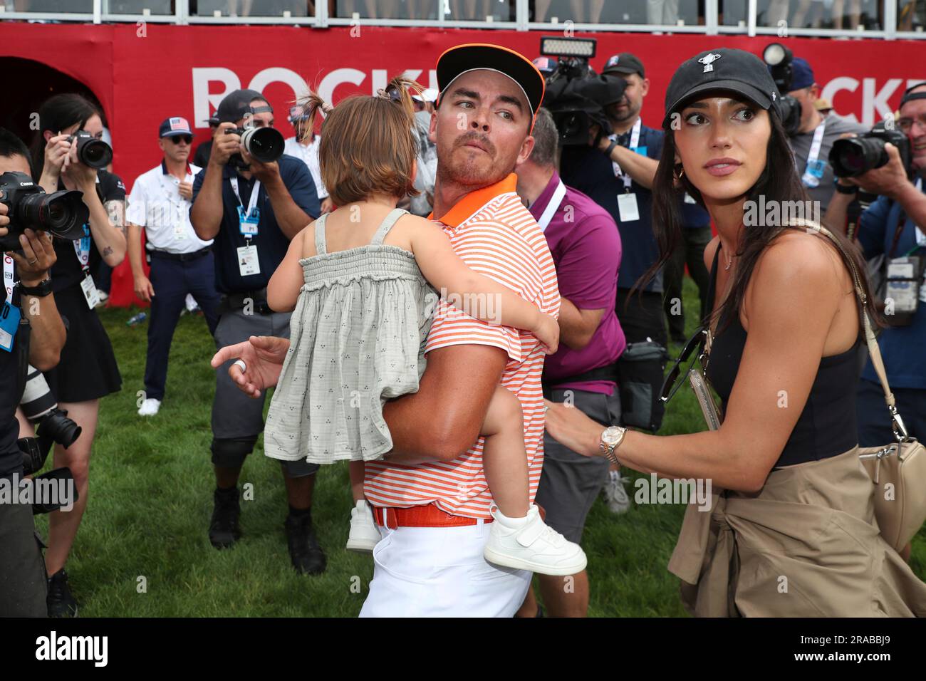 DETROIT, MI - JULY 02: PGA golfer Rickie Fowler holding his daughter ...