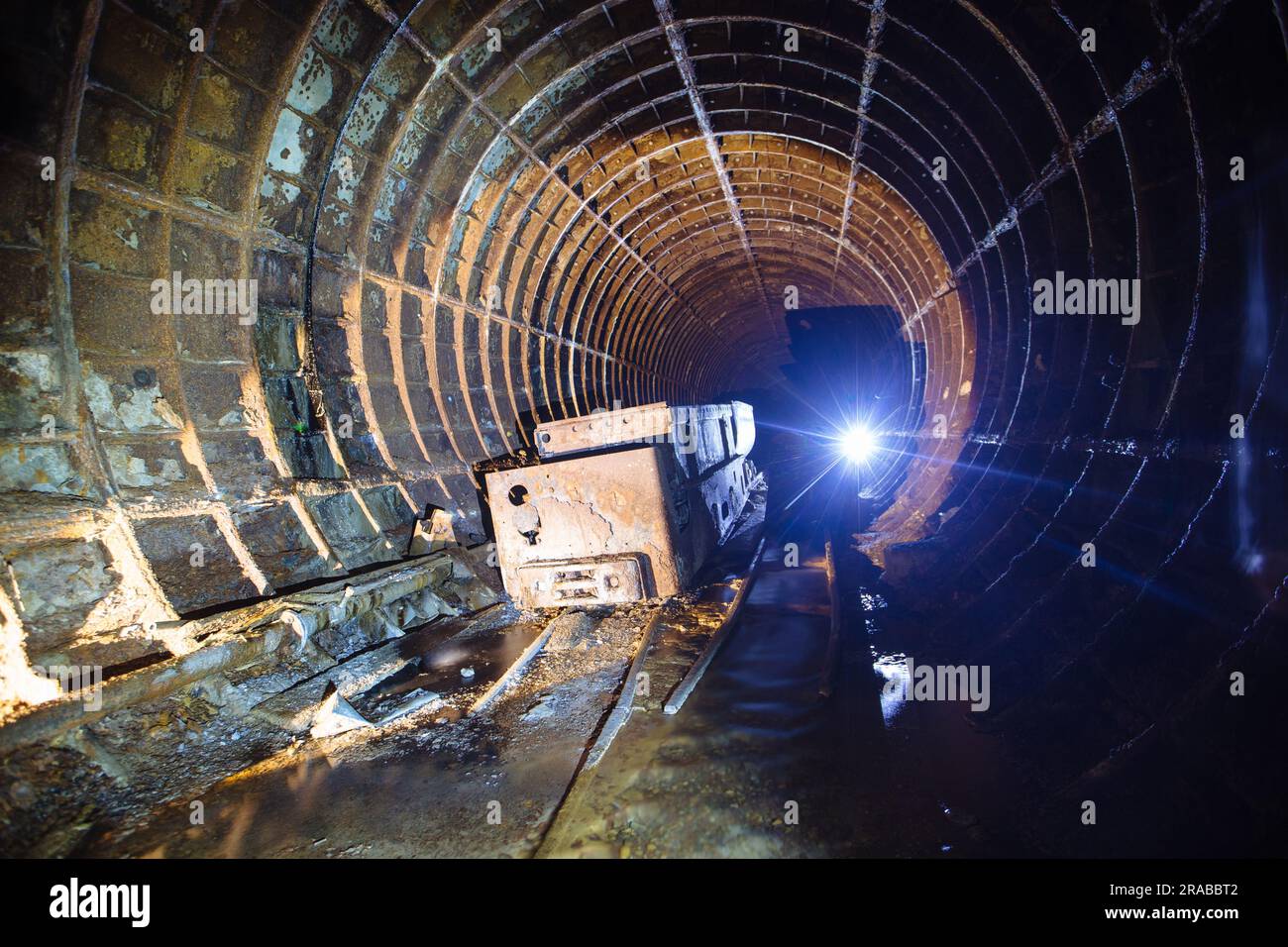 Old abandoned subway tunnel with rusty trolley locomotive Stock Photo ...