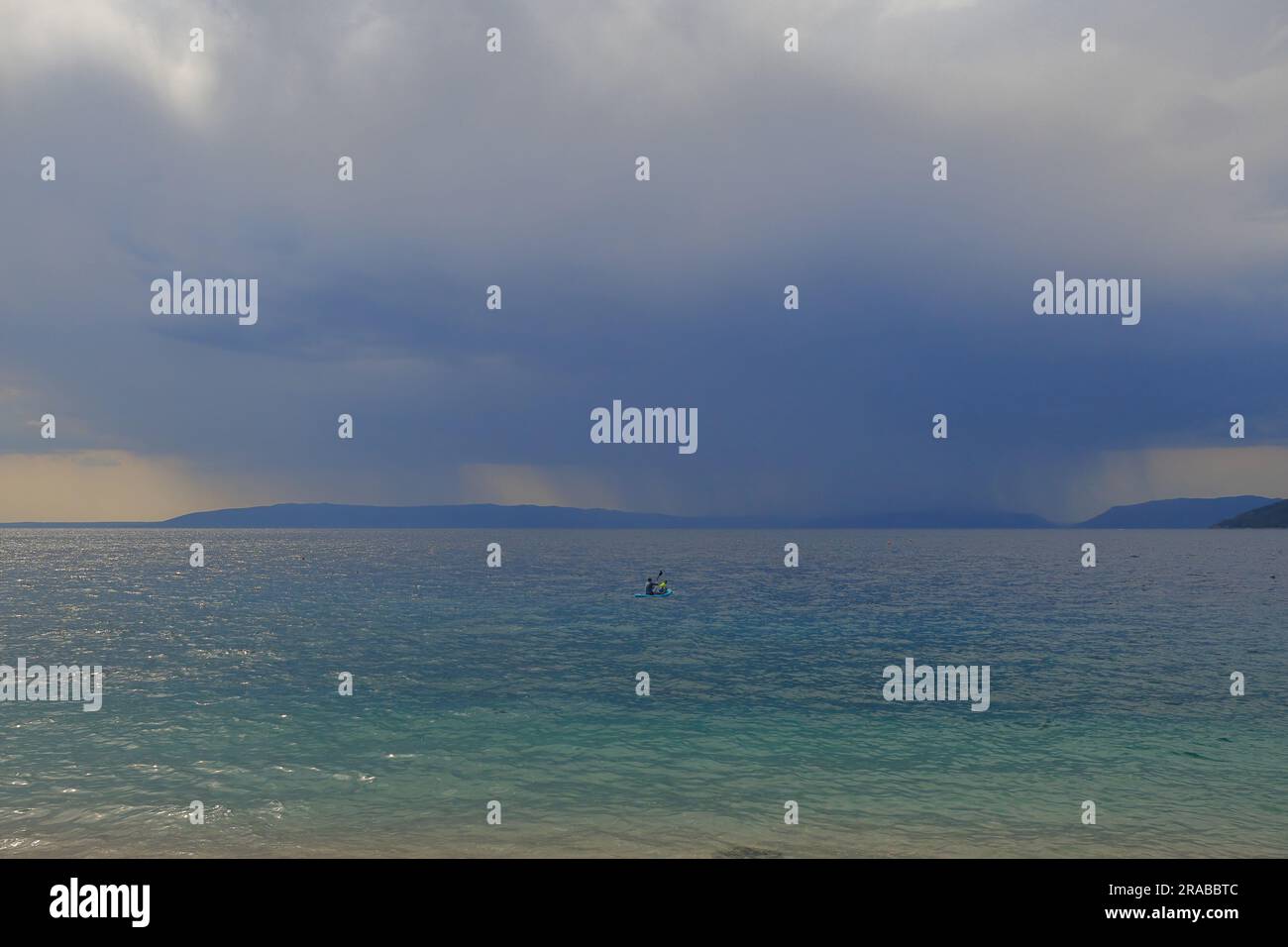 Over an island heavy skies hi-res stock photography and images - Alamy