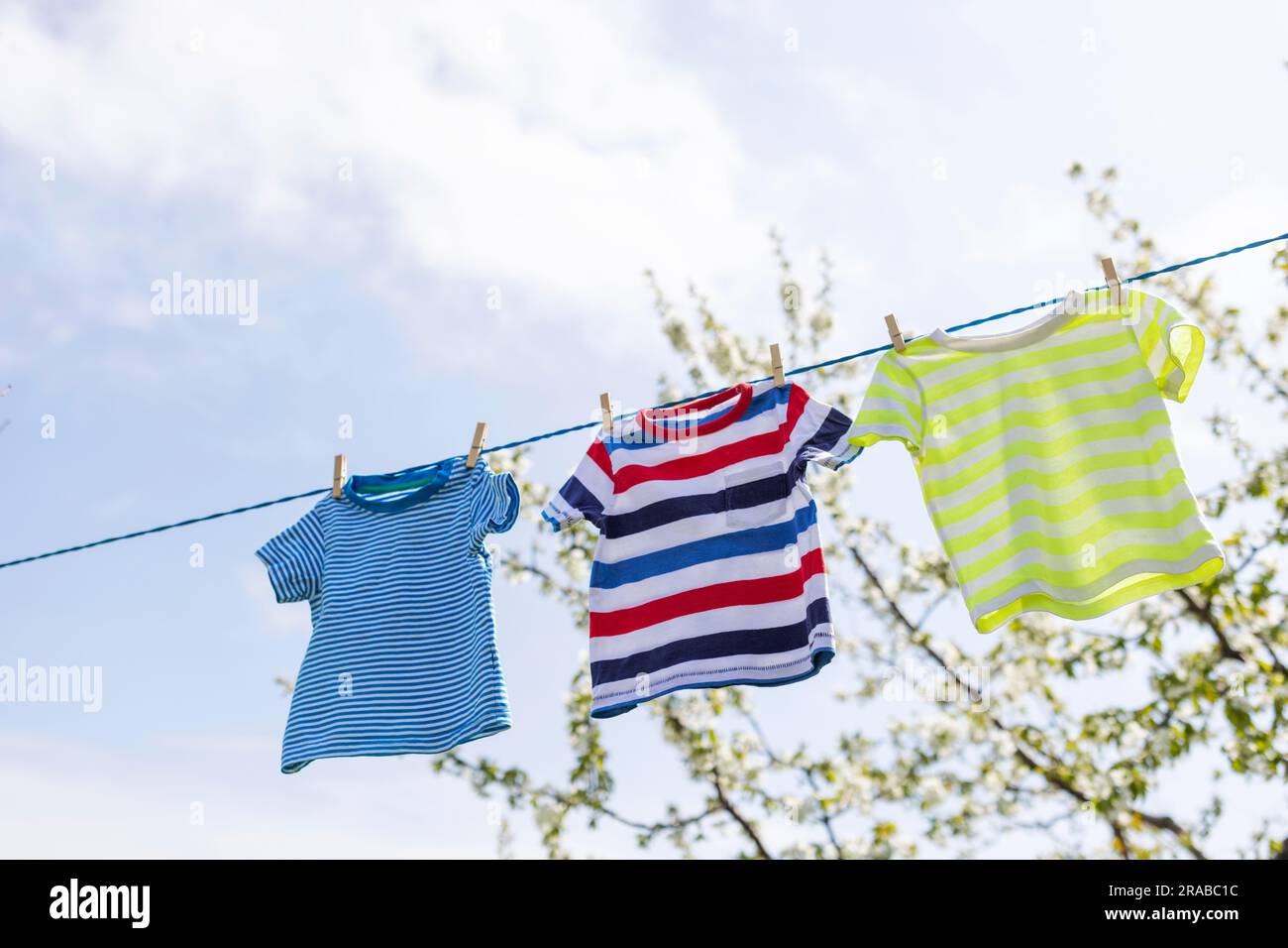 Clean clothes on rope outdoors on laundry day Stock Photo - Alamy