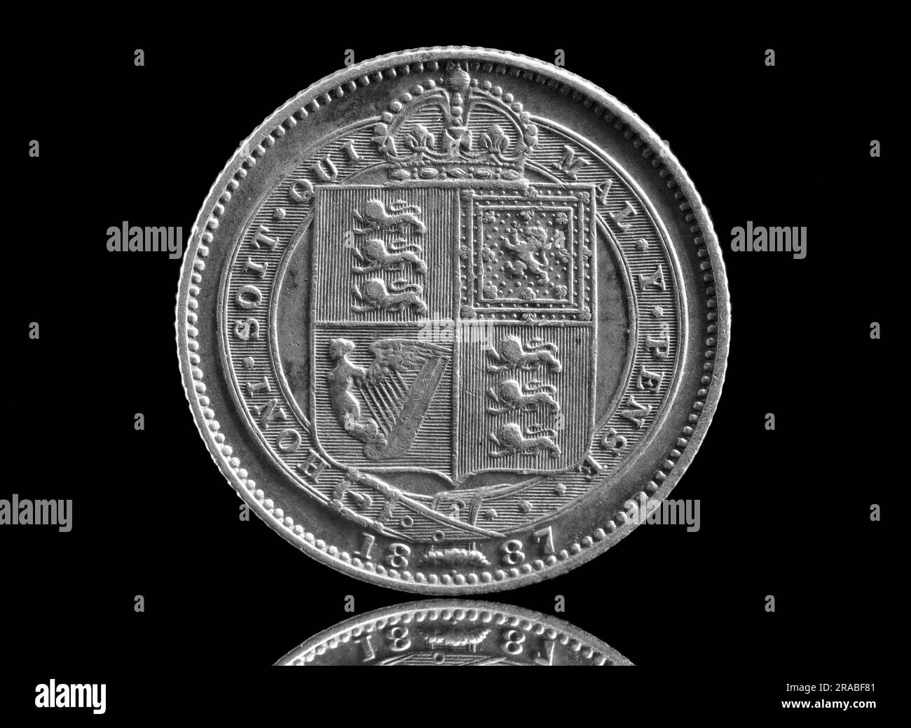 Reverse side of an 1887 Silver shilling featuring a crowned royal ...
