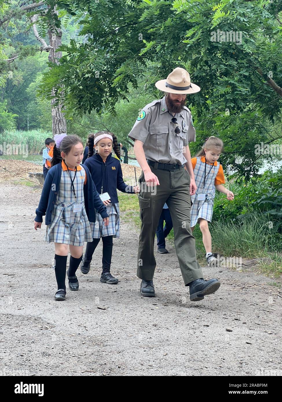 Park ranger leads young school children on a walk in Prospect Park ...