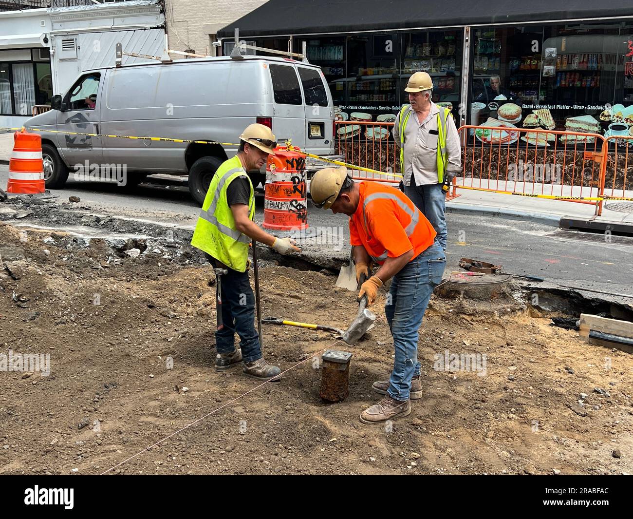 Infrasgtructure renovation is a constant in New York City. Men work ...