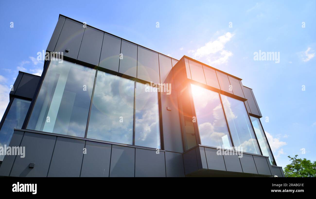 Graphite facade and large windows on a fragment of an office building ...