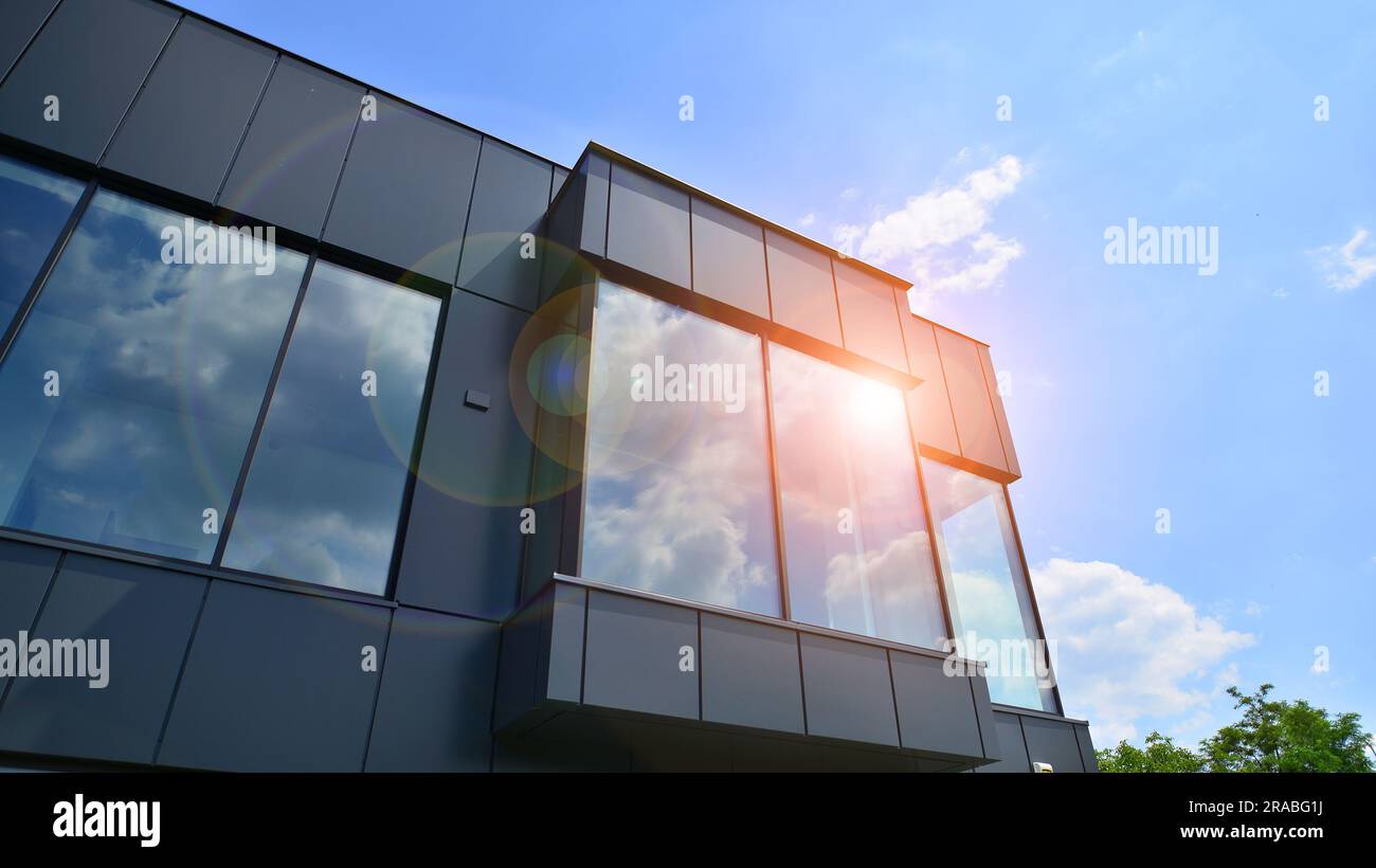 Graphite facade and large windows on a fragment of an office building ...